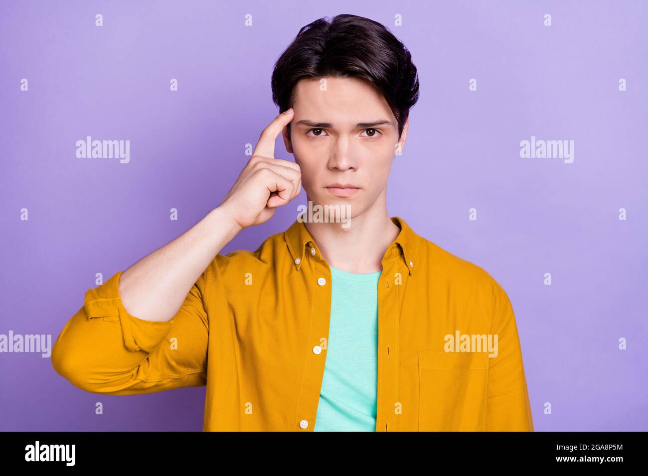 Photo of young man finger touch head accuse stupid blame think isolated ...