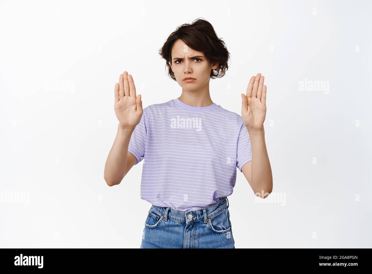 Young modern woman show block, stop no gesture, decline, rejecting ...