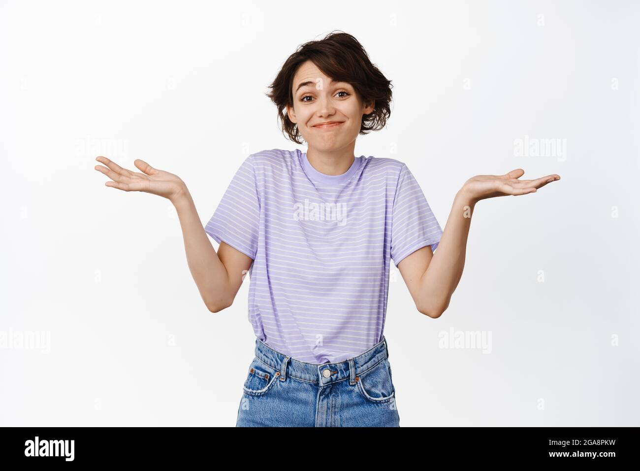 Sorry dont care, nothing to say. Smiling young ubothered woman ...