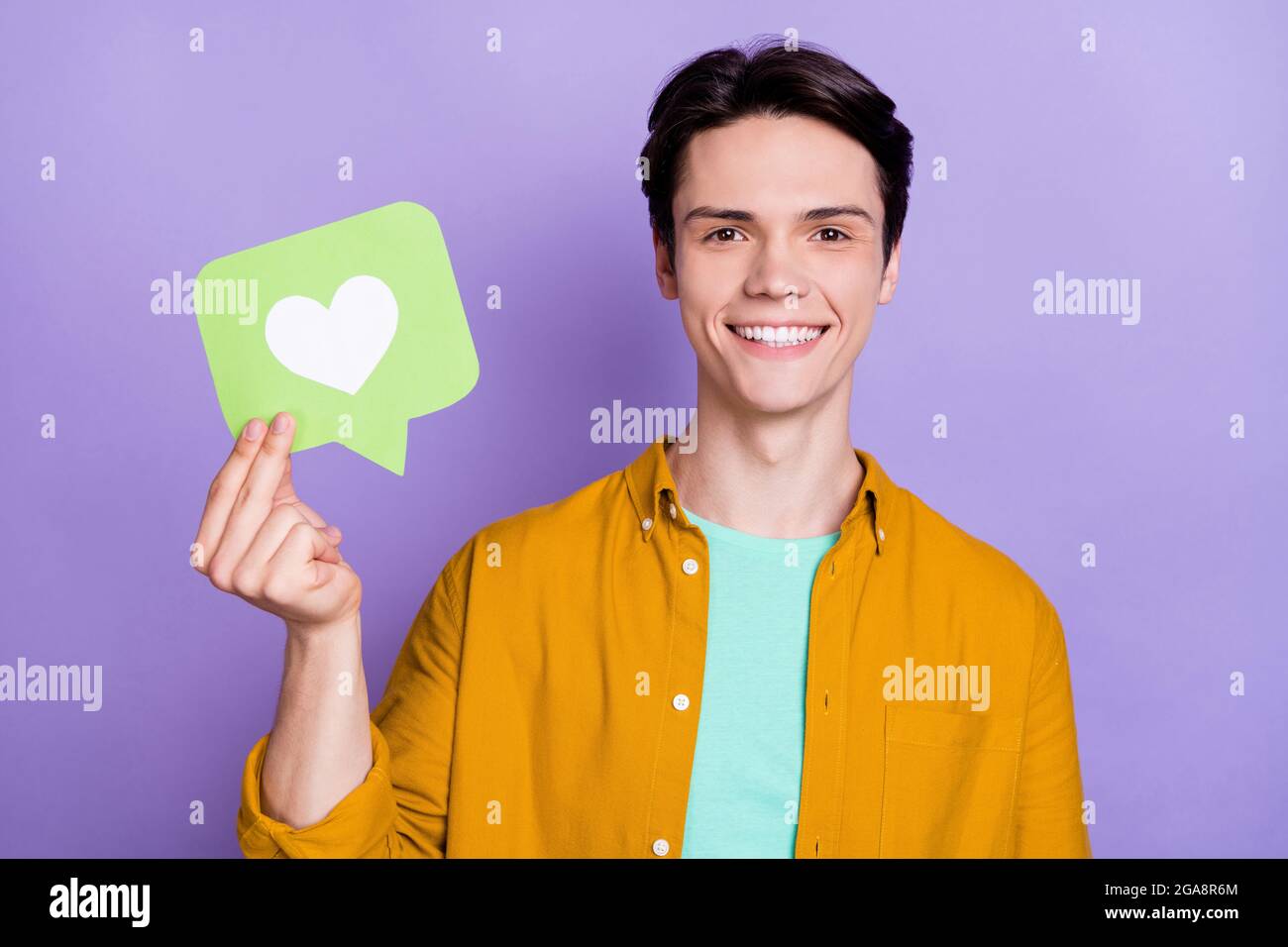 Photo of young man happy positive smile show heart like reaction icon ...
