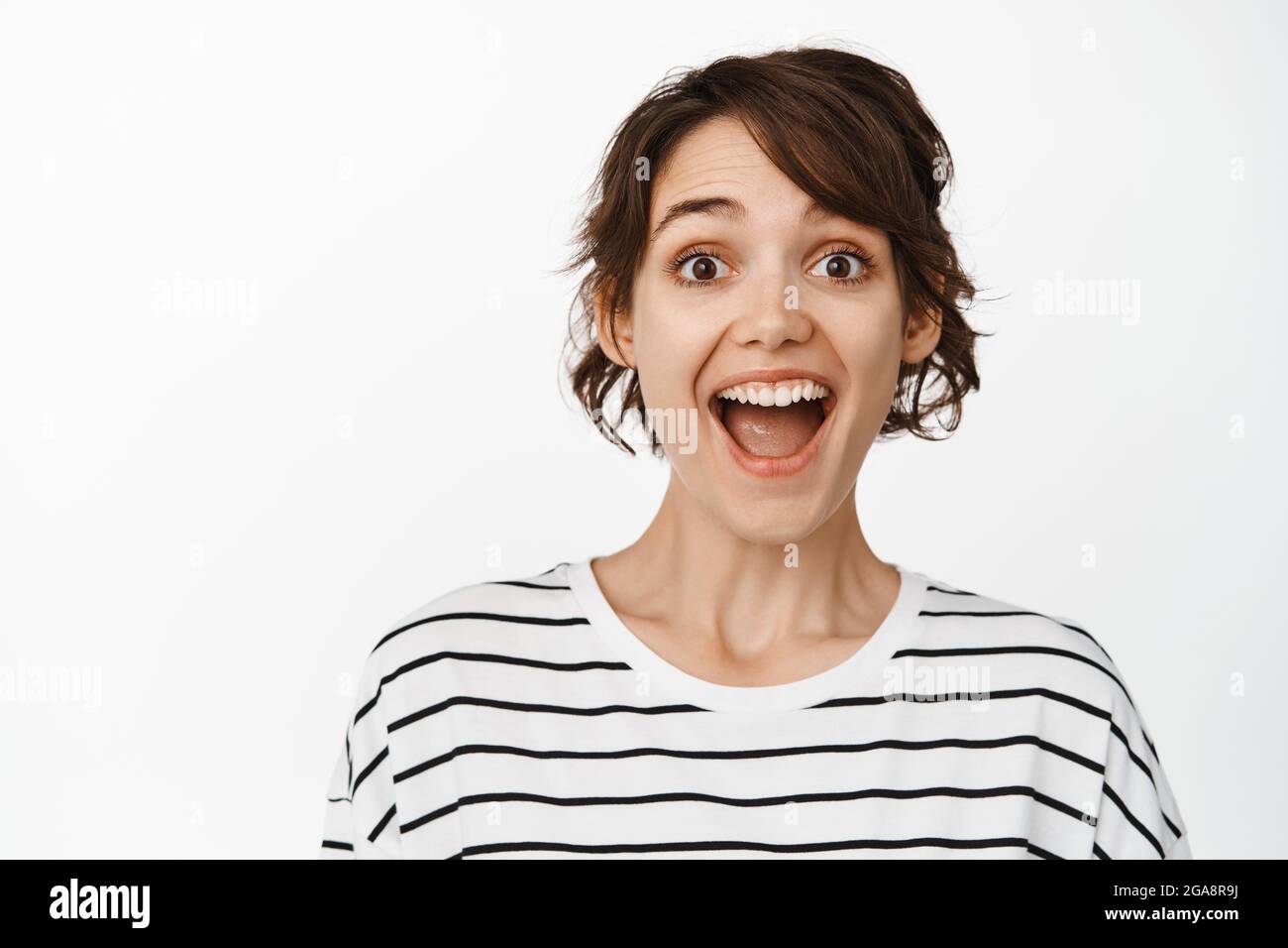Close Up Portrait Of Surprised And Amazed Brunette Woman Gasping