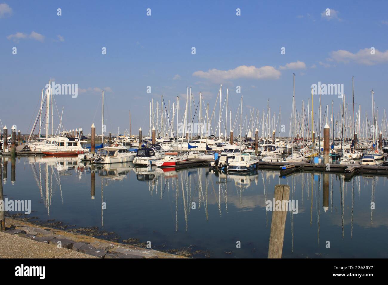 the marina with fishing boats and yachts of breskens at the dutch coast ...