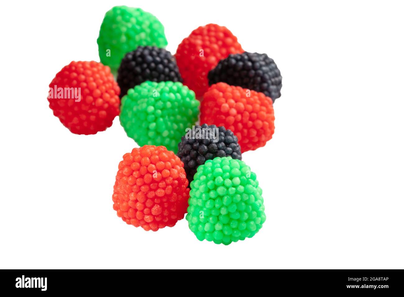Handful of raspberry shaped gummy candies isolated on white Stock Photo ...