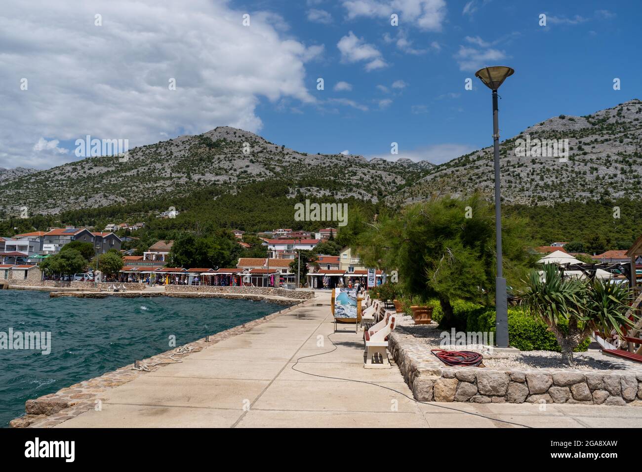 STARI GRAD, CROATIA - Jul 14, 2021: A walkway in the city near the sea ...