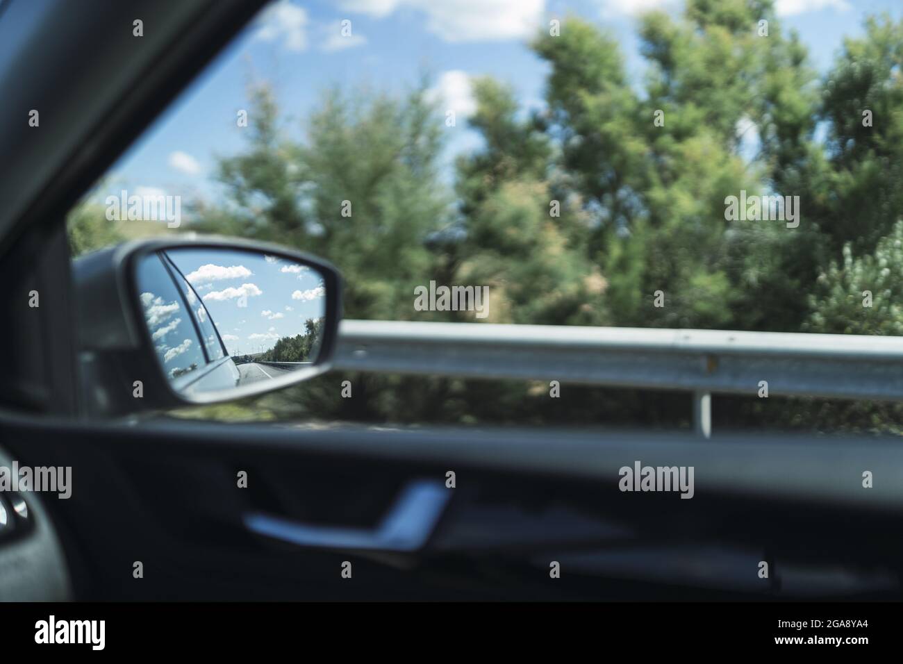 Side mirror of the car with a reflection seen from inside Stock Photo ...