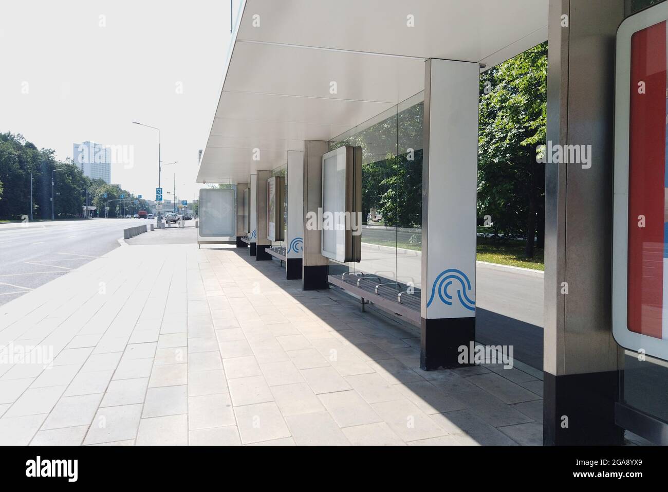 City bus stop by the road. At the bus stop, white empty advertising ...