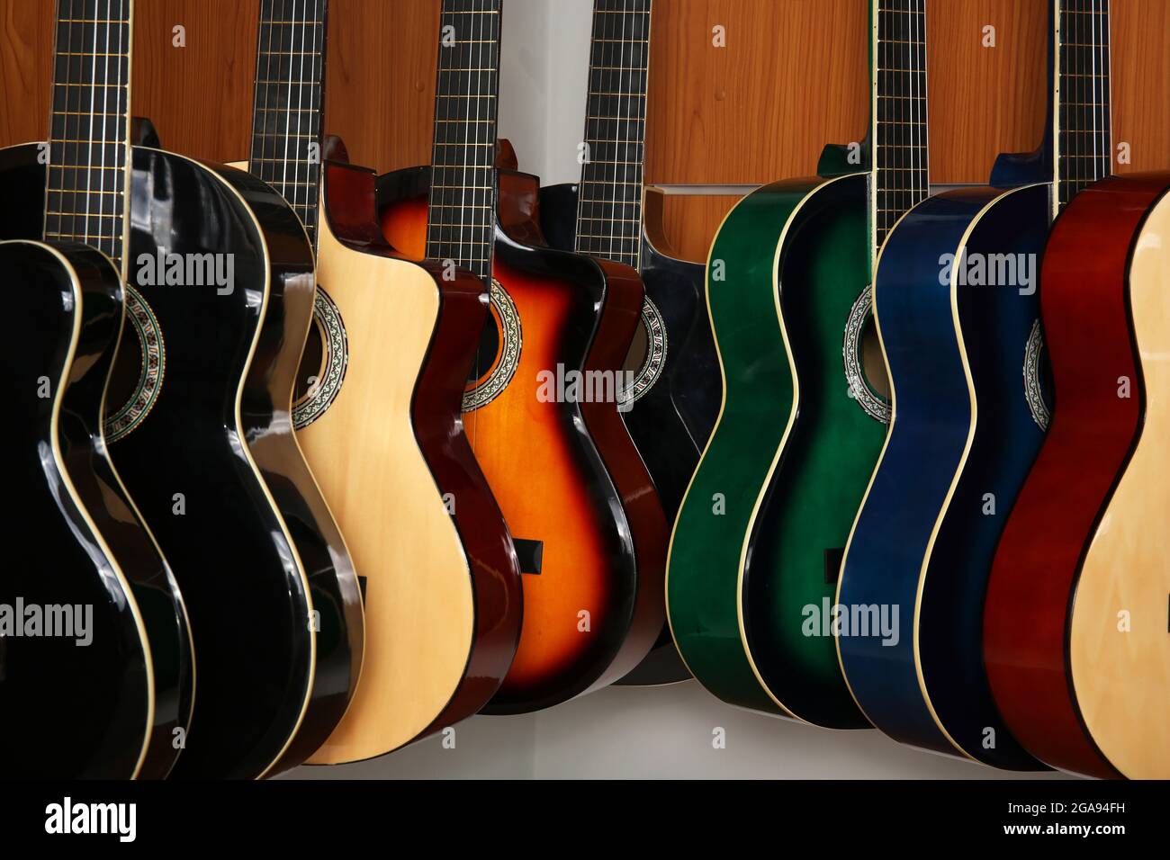 Guitars in music store Stock Photo - Alamy
