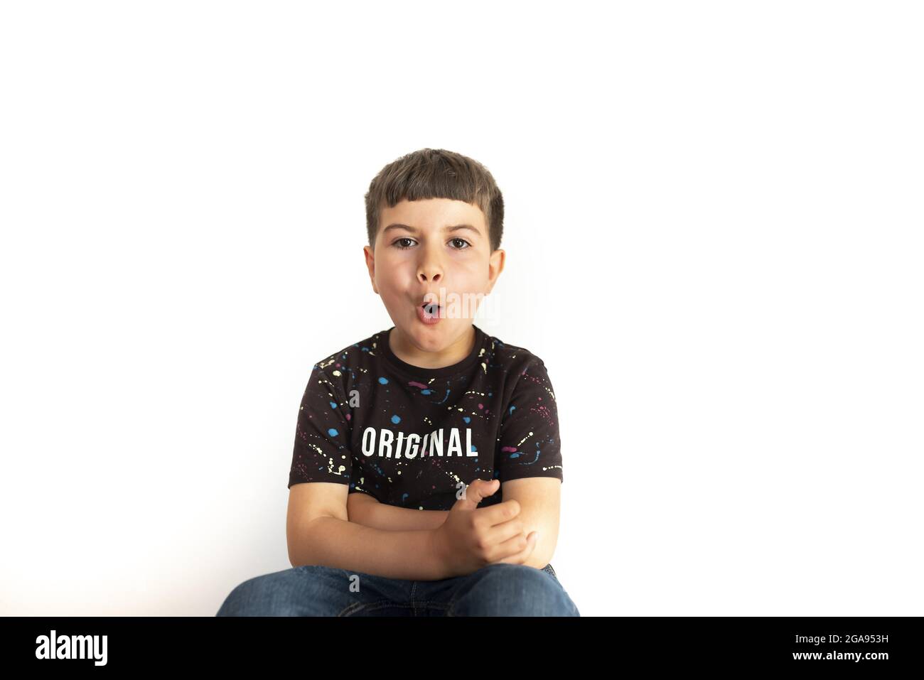 Caucasian boy exclaiming surprise on white background Stock Photo - Alamy