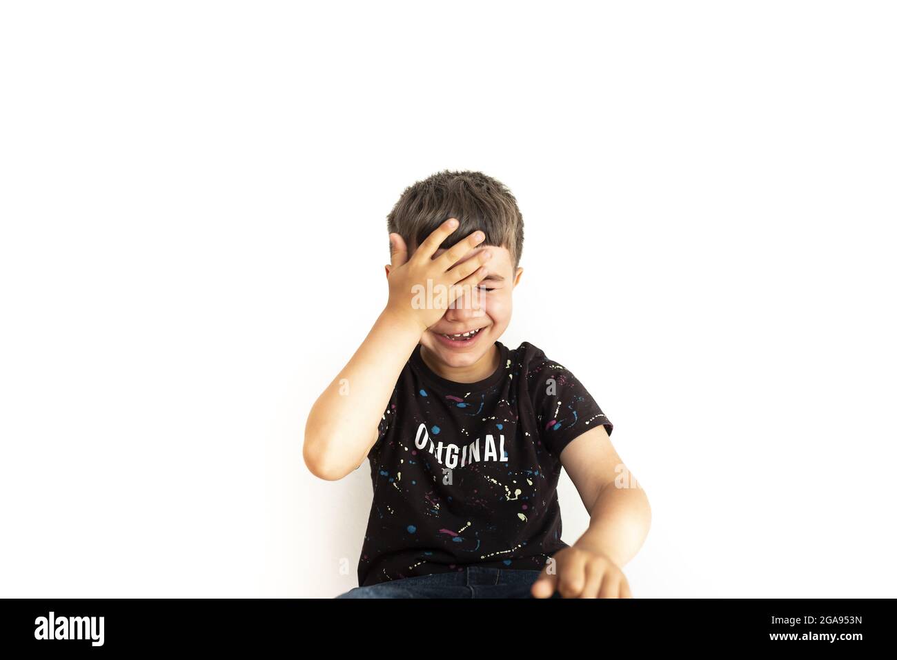 caucasian child expressing forgetfulness with open hand on forehead on ...