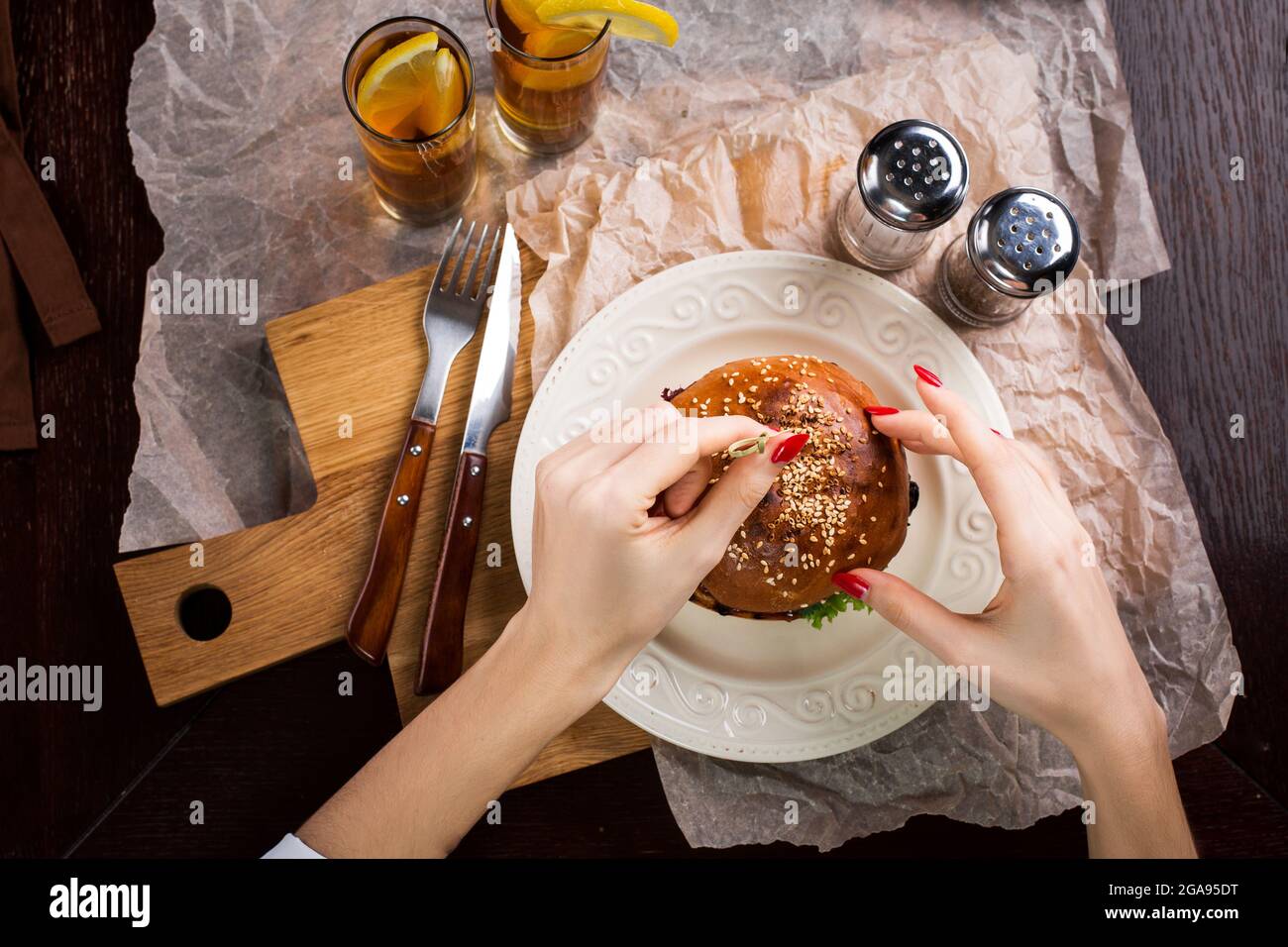 Person eating burger bbq hi-res stock photography and images - Alamy