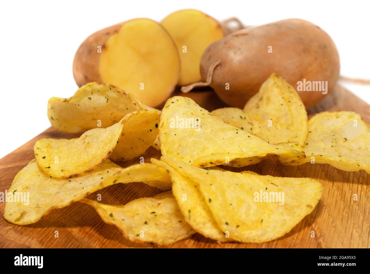 Potato Crisps with spices and potatoes on a white background Potato ...