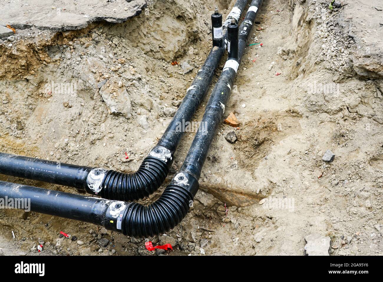 right angle turn of the new thermally isolated heating pipe in a ...