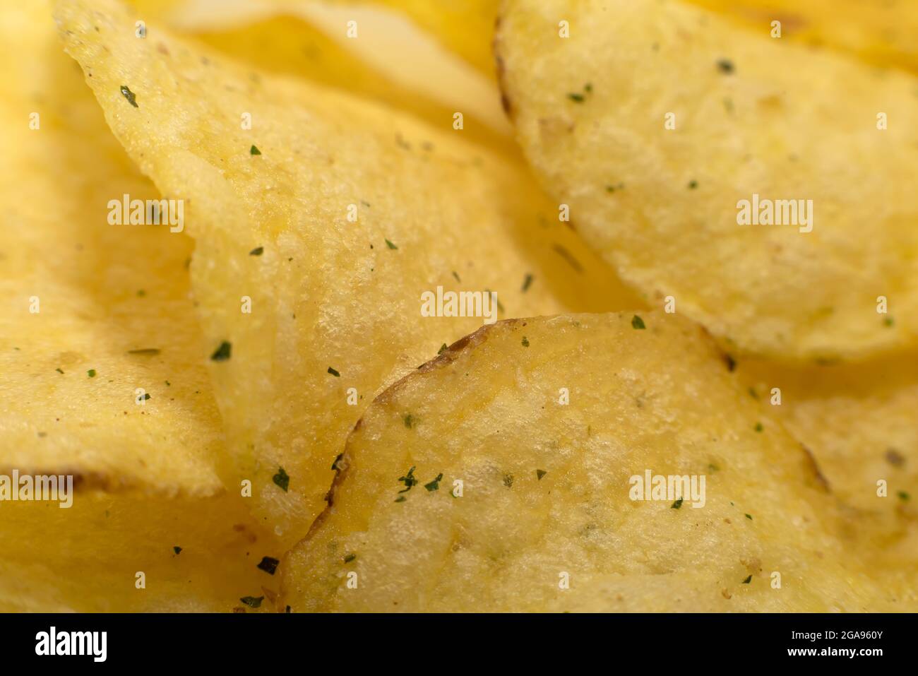 Potato Crisps with spices. Potato chips close-up Stock Photo - Alamy