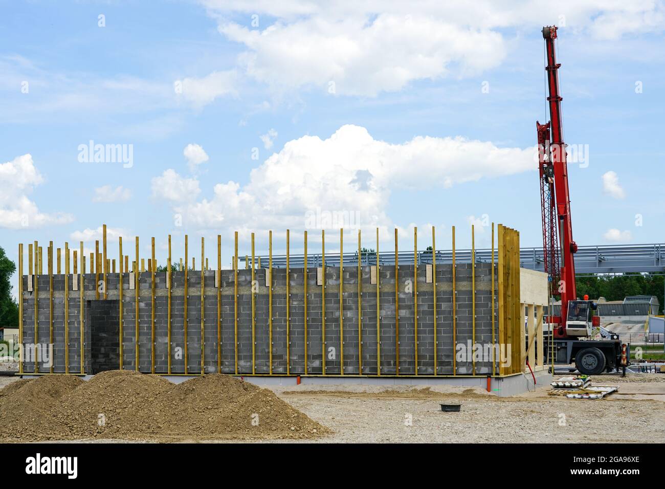 the facade of a new building built of building blocks with wooden laths ...