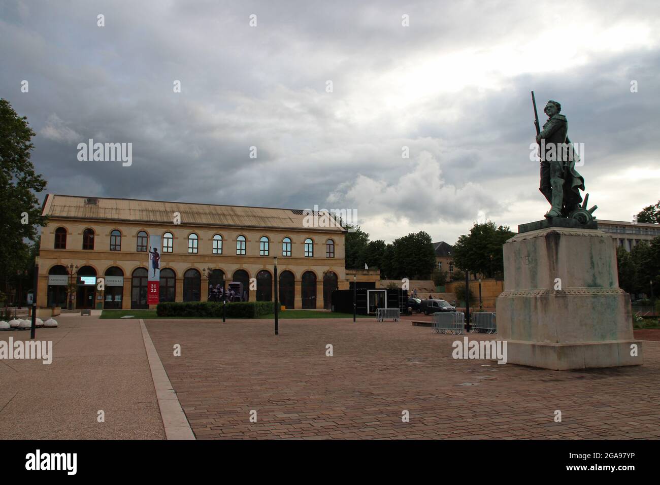 building (l'arsenal) and statue at république square in metz in ...