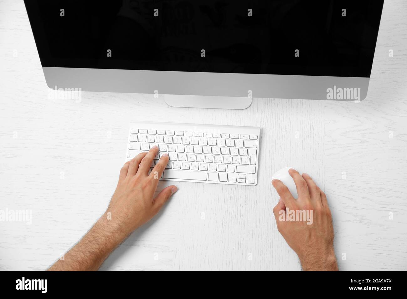 Man hand on computer keyboard on table top view Stock Photo - Alamy