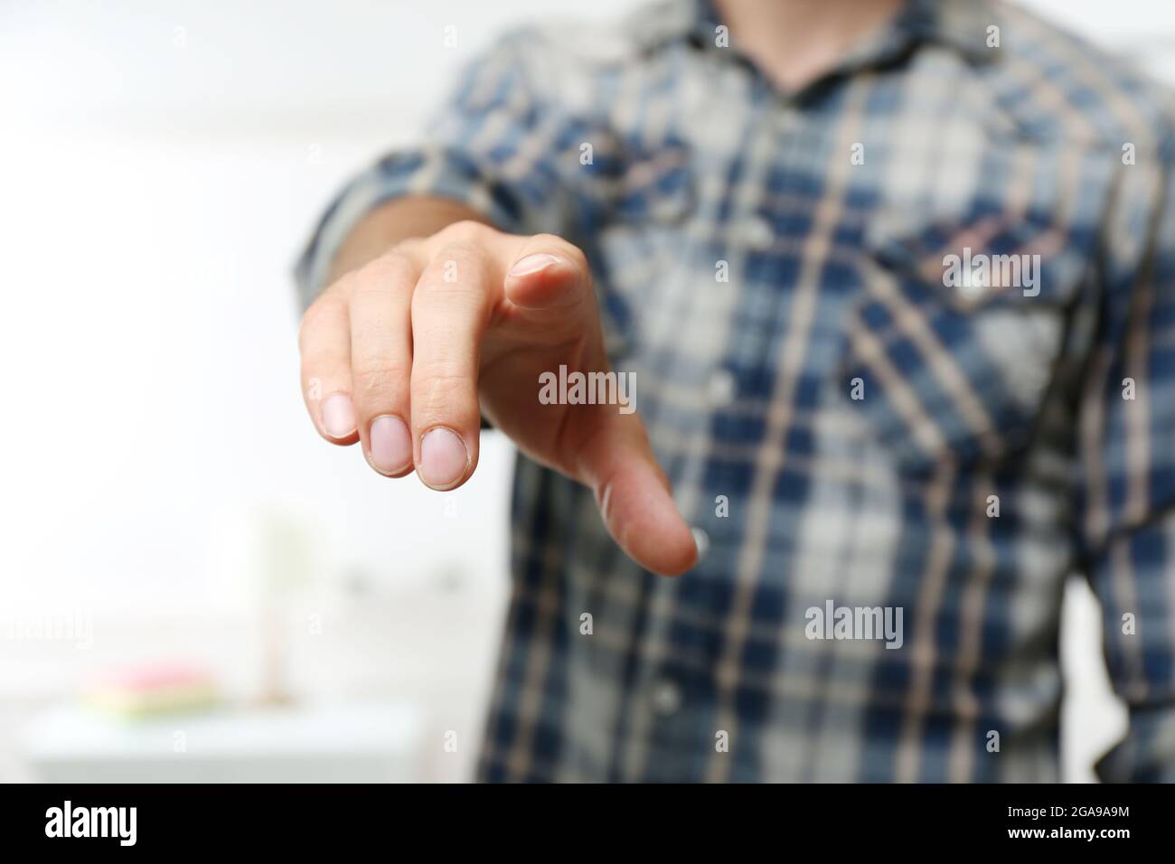 Young man push button Stock Photo - Alamy