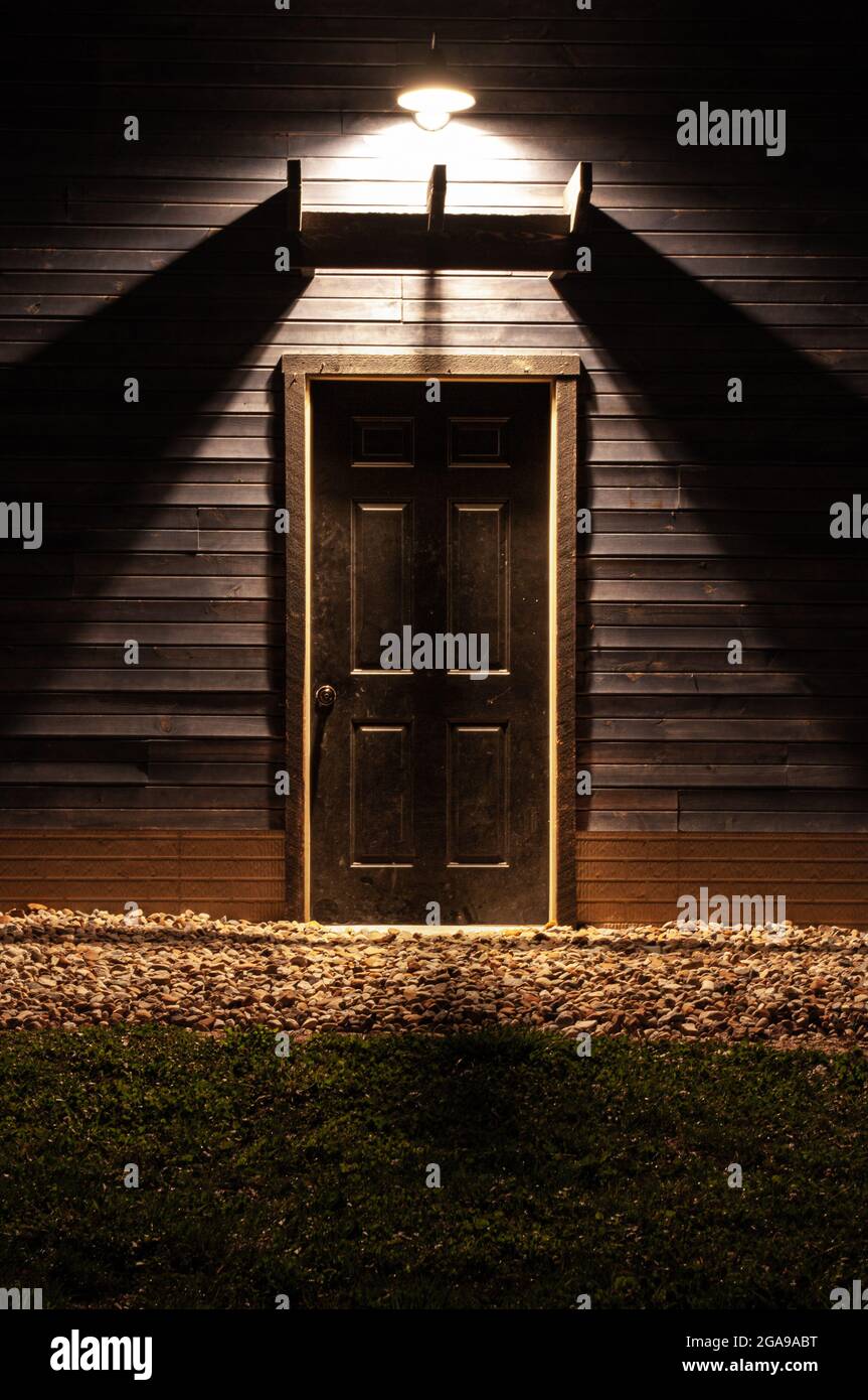 An illuminated door at night Stock Photo - Alamy