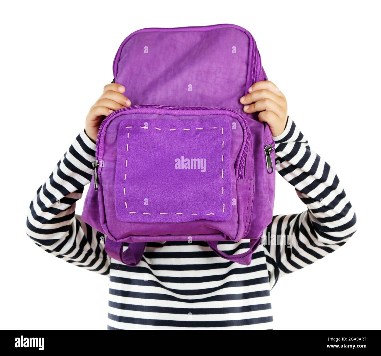 Beautiful little girl holding backpack isolated on white Stock Photo ...