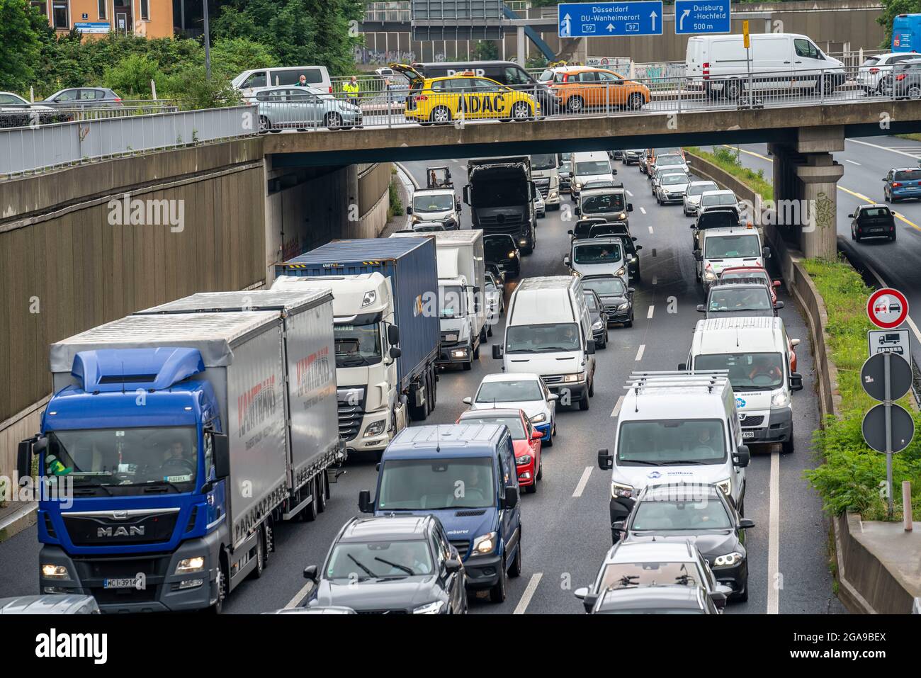 Traffic jam on the A59 freeway, passing through the city of Duisburg ...