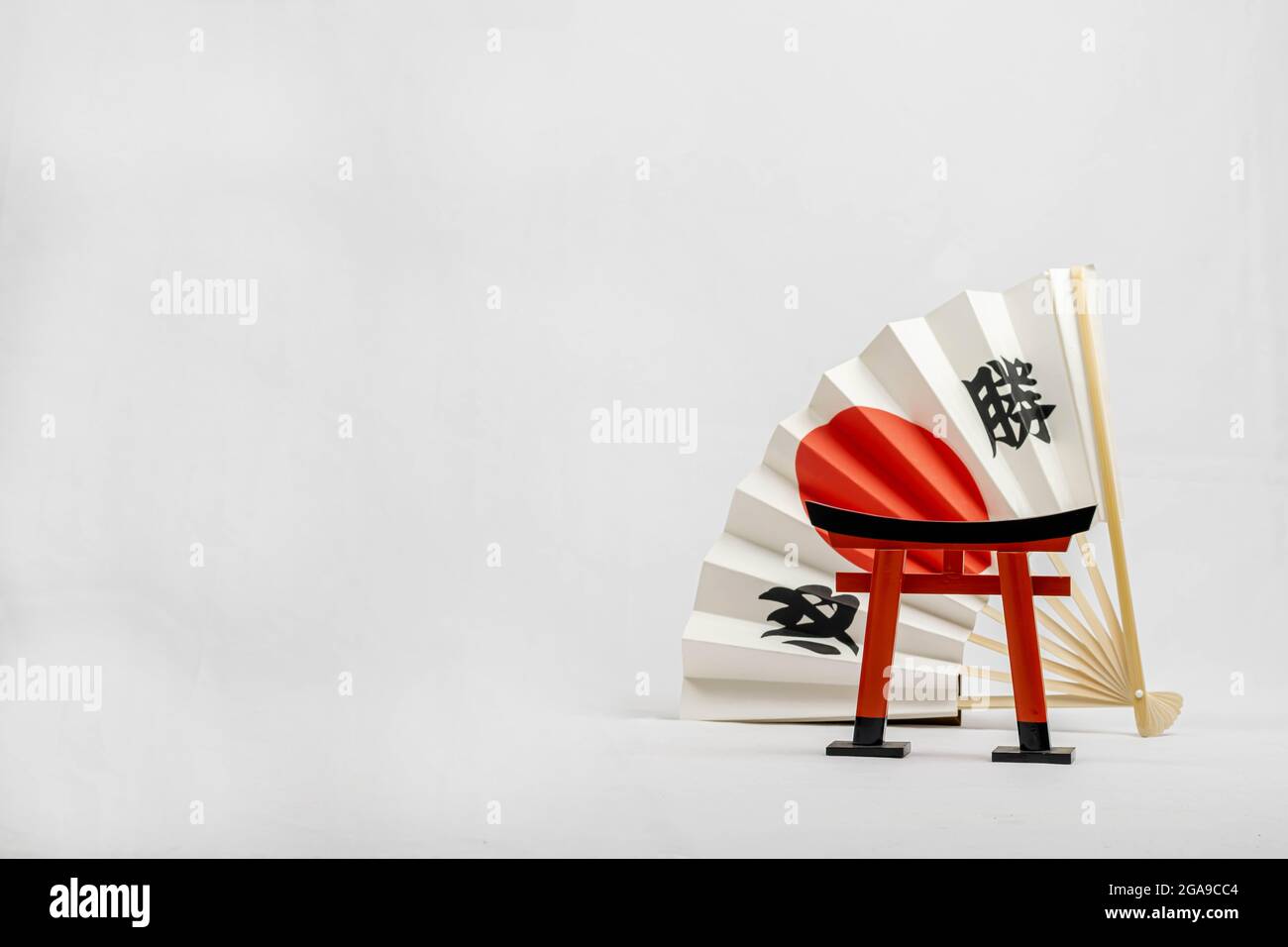 Japanese hand fan and typical japanese religious red monument Stock ...