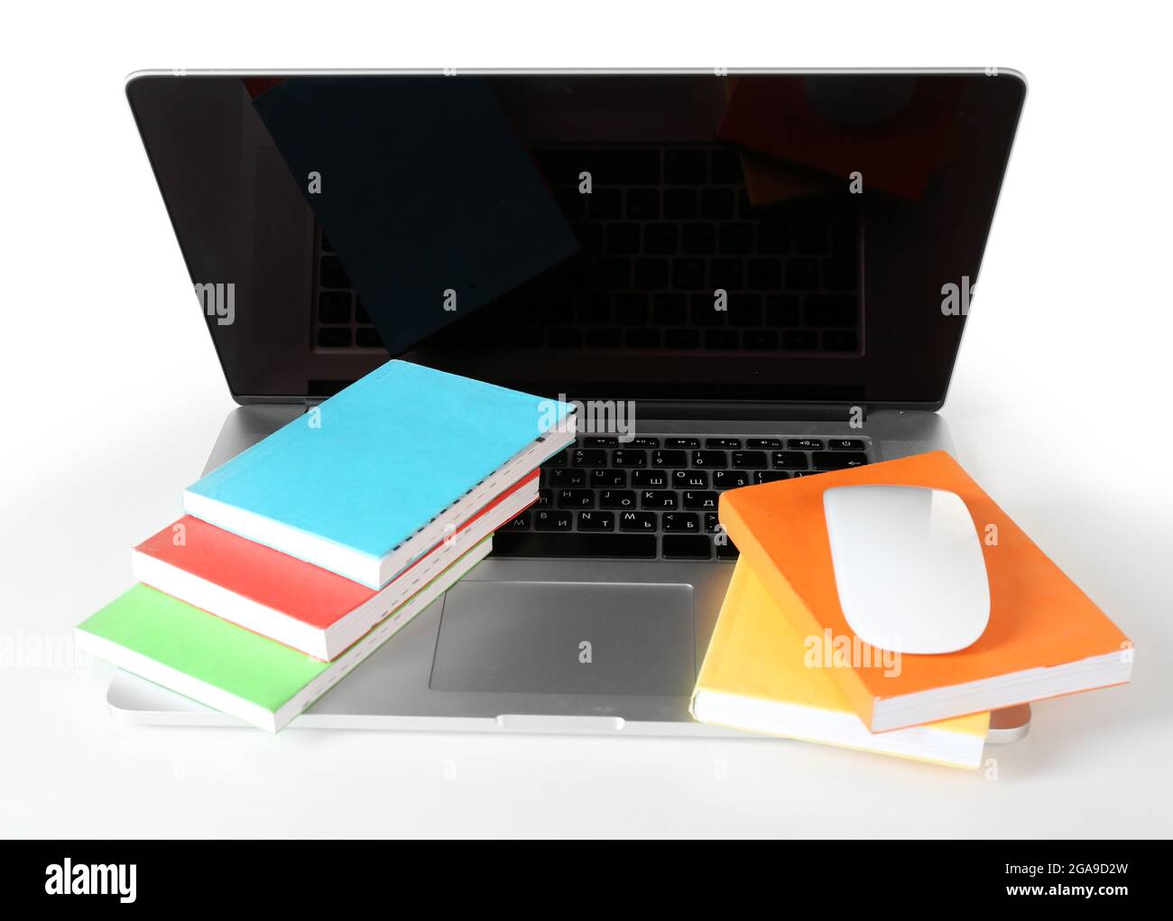 Stack of books with laptop close up Stock Photo - Alamy