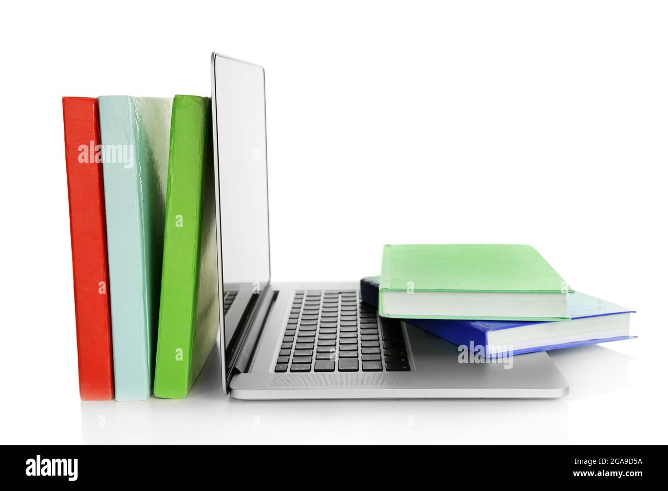 Stack of books with laptop isolated on white Stock Photo - Alamy