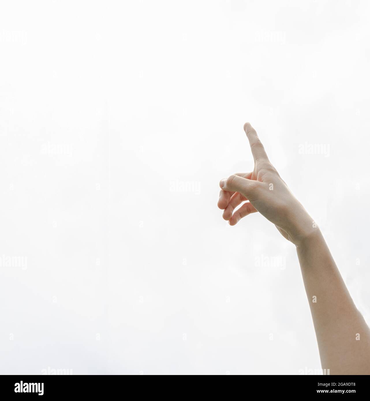 arm with finger pointing upwards with copy space concept target ...