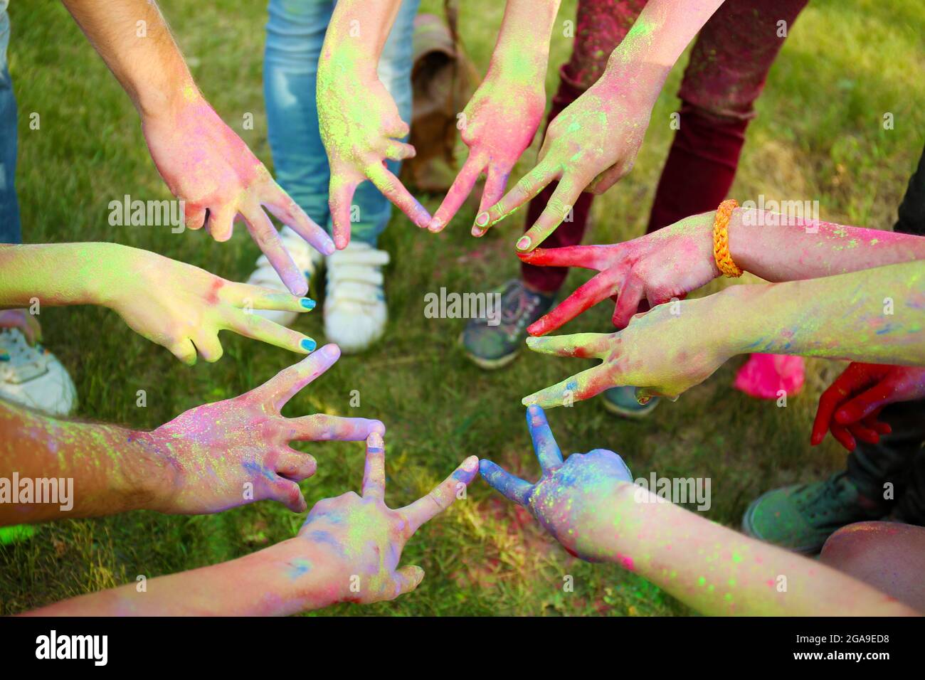 Hands of young people with Indian dyes on Holi color festival Stock ...
