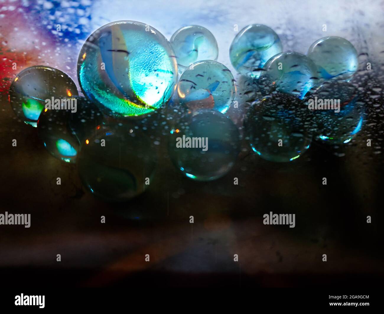 Marbles floating in the water Stock Photo - Alamy