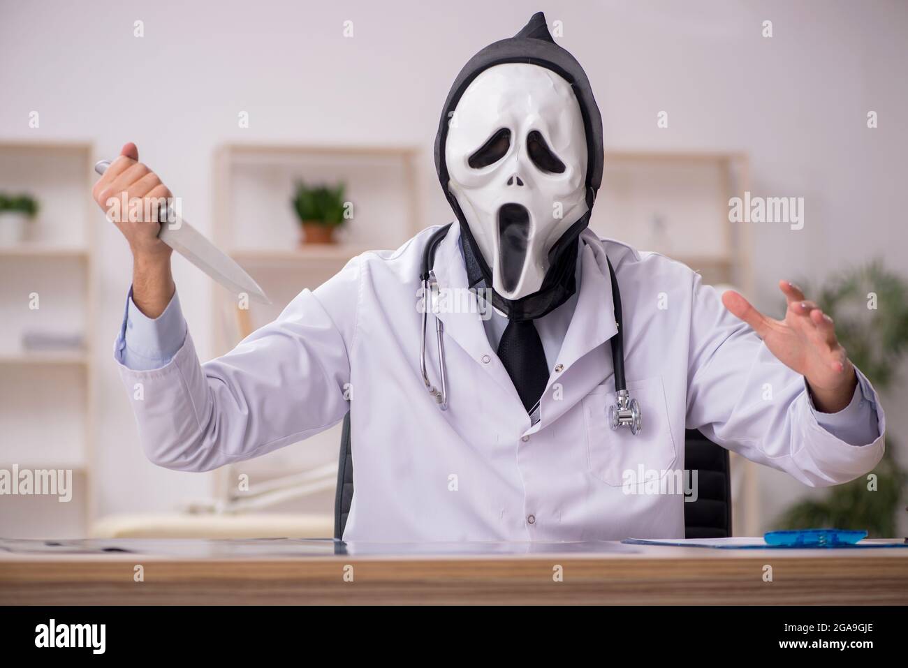 Devil doctor working at the hospital Stock Photo - Alamy