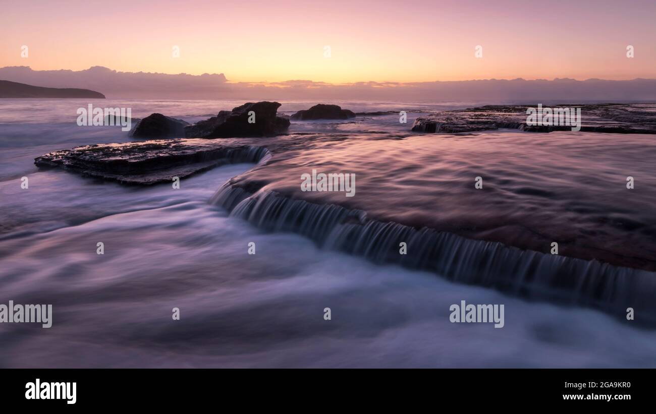 colourful sunset over a body of water Stock Photo - Alamy