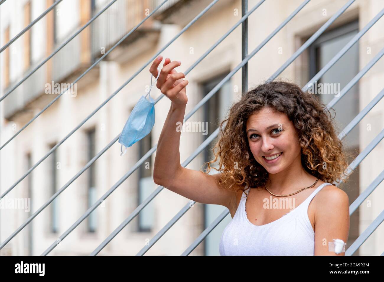Woman taking off mask hi-res stock photography and images - Alamy