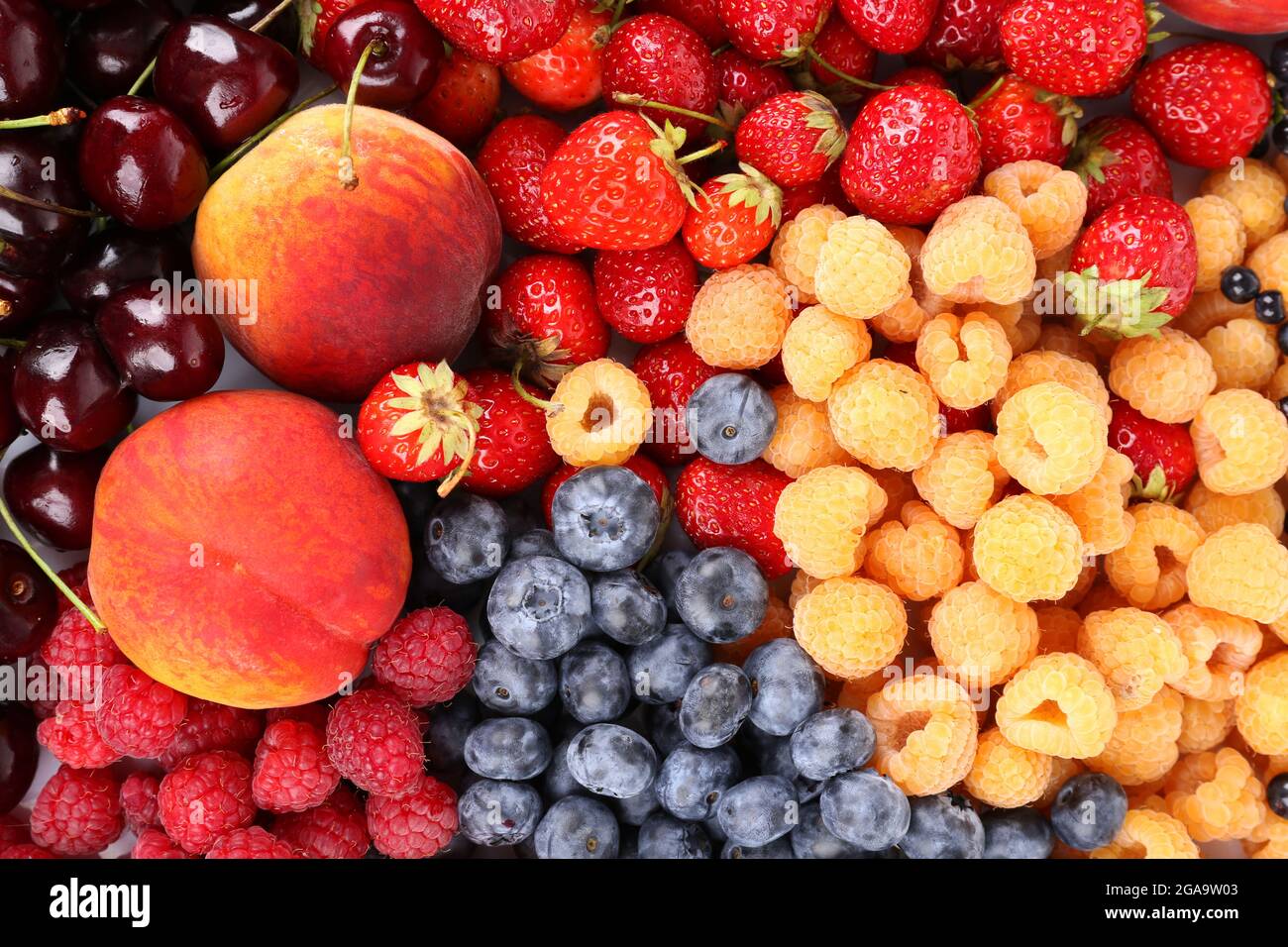 Mix of different berries as background Stock Photo - Alamy