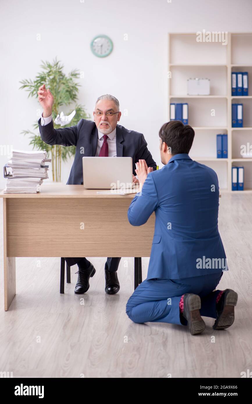 Two employees in dismissal concept Stock Photo - Alamy
