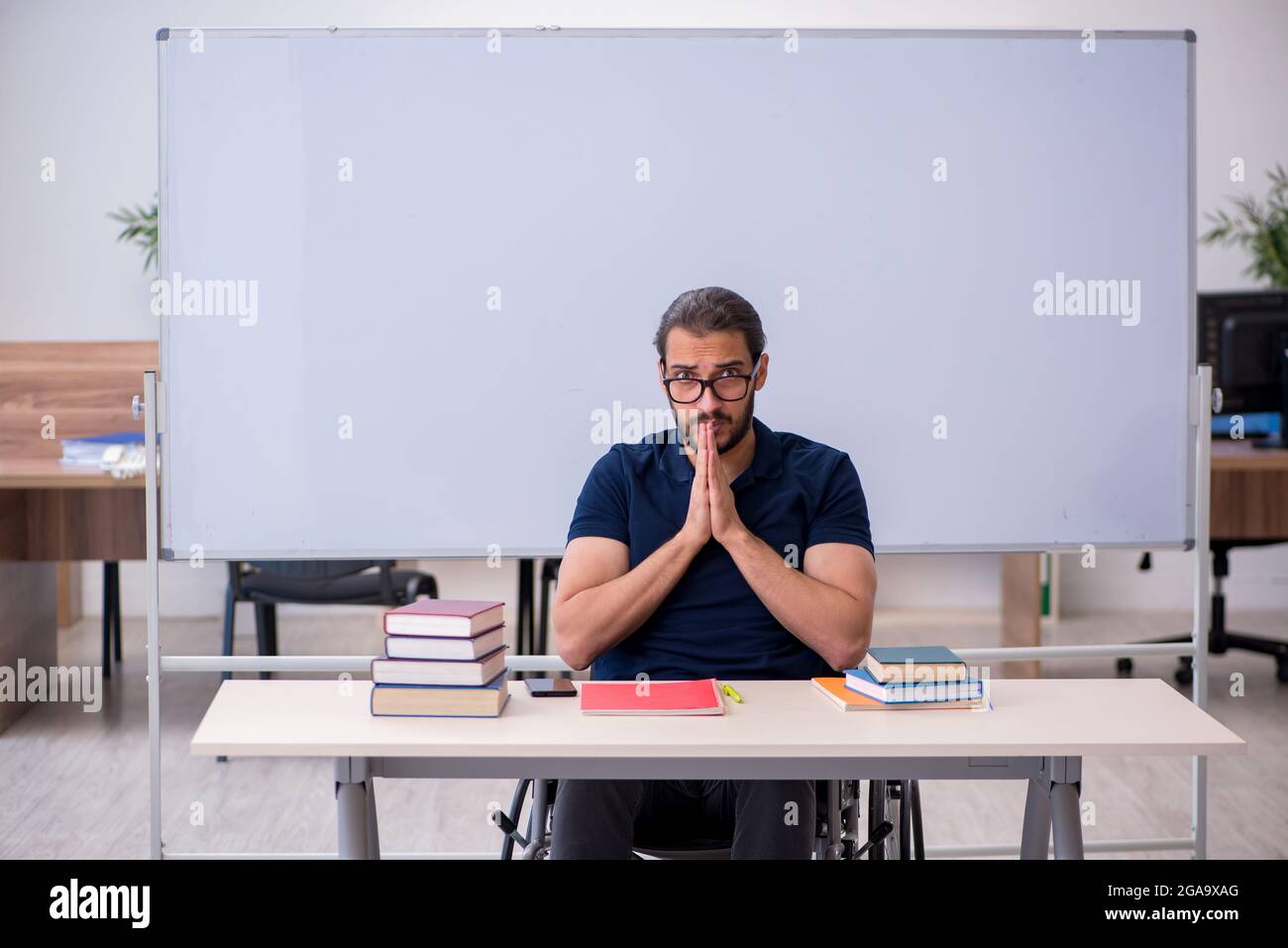 Young handicapped student in the classroom Stock Photo - Alamy