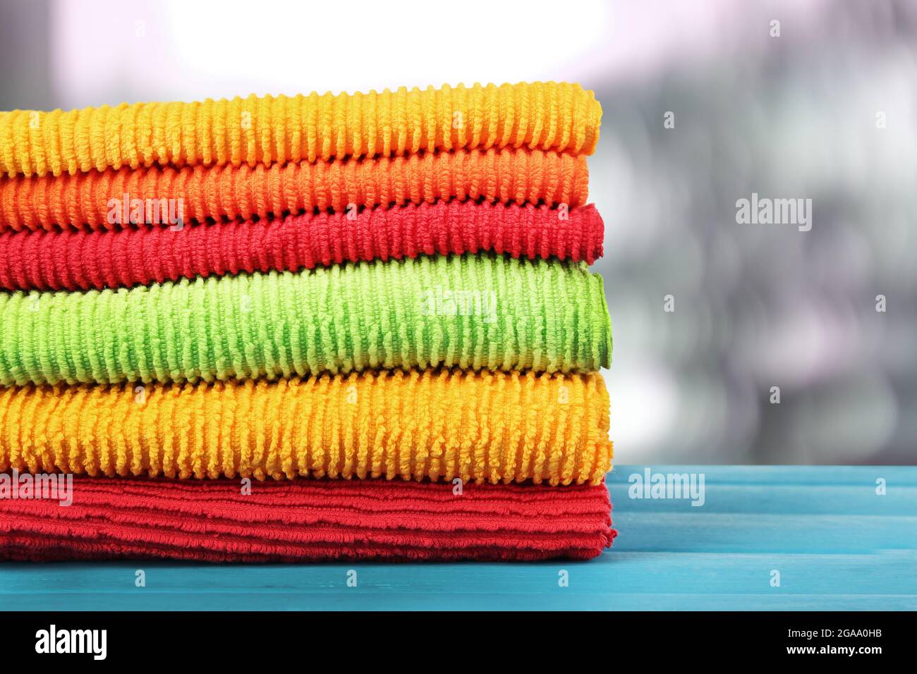 Colorful towels on light background Stock Photo - Alamy