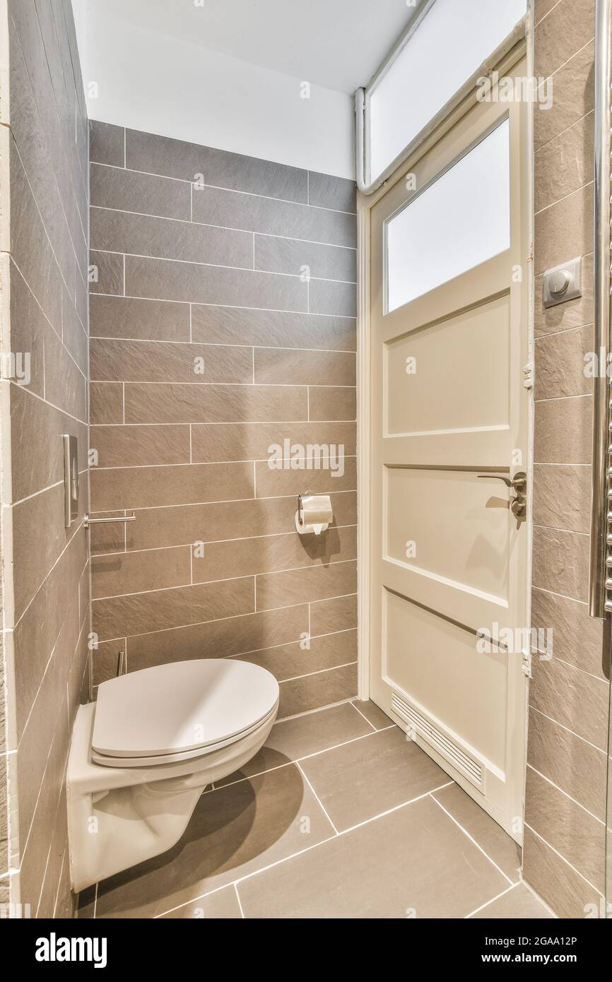 Interior of small clean washroom in miniature style Stock Photo - Alamy