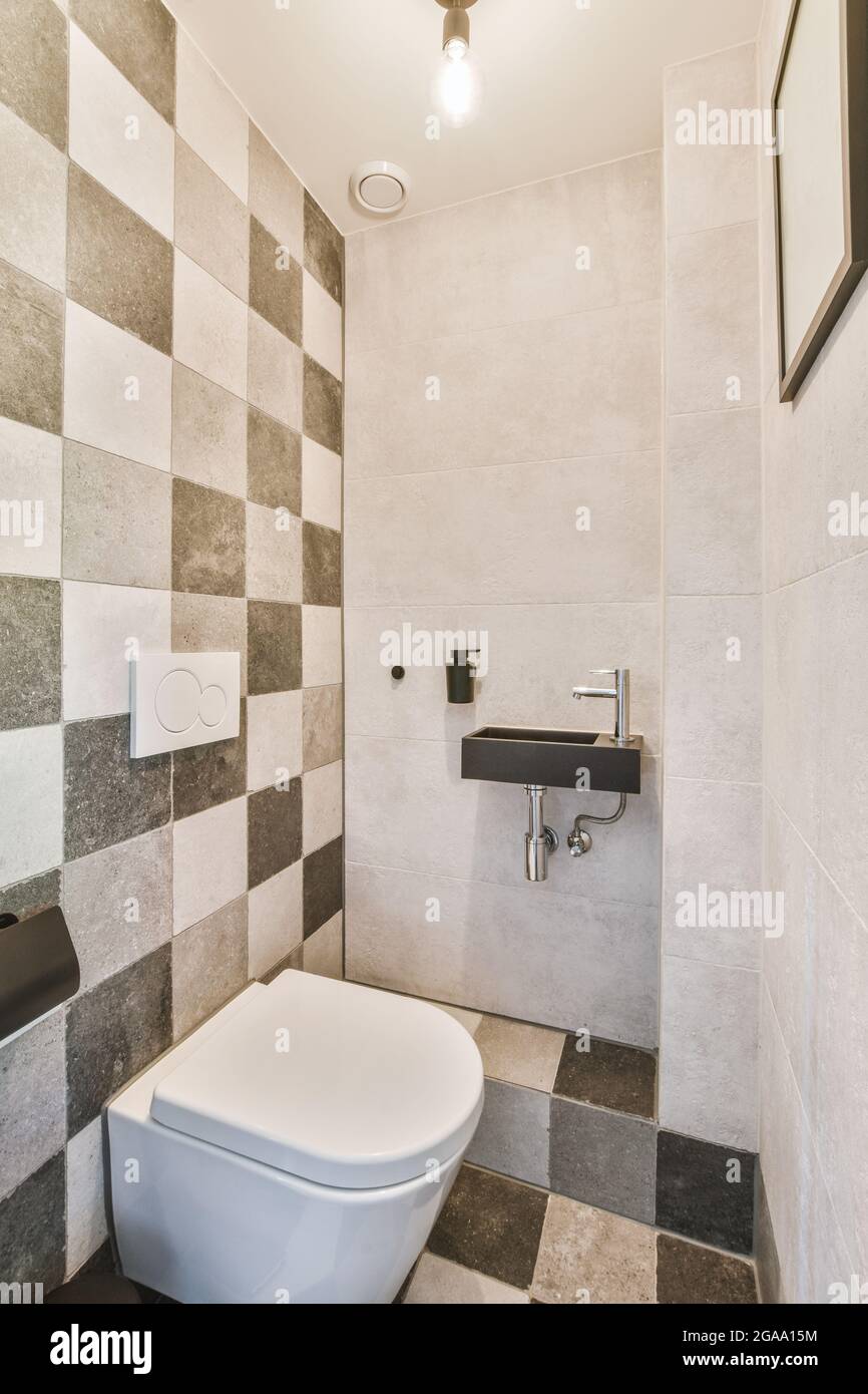 Interior of small clean washroom in miniature style Stock Photo - Alamy
