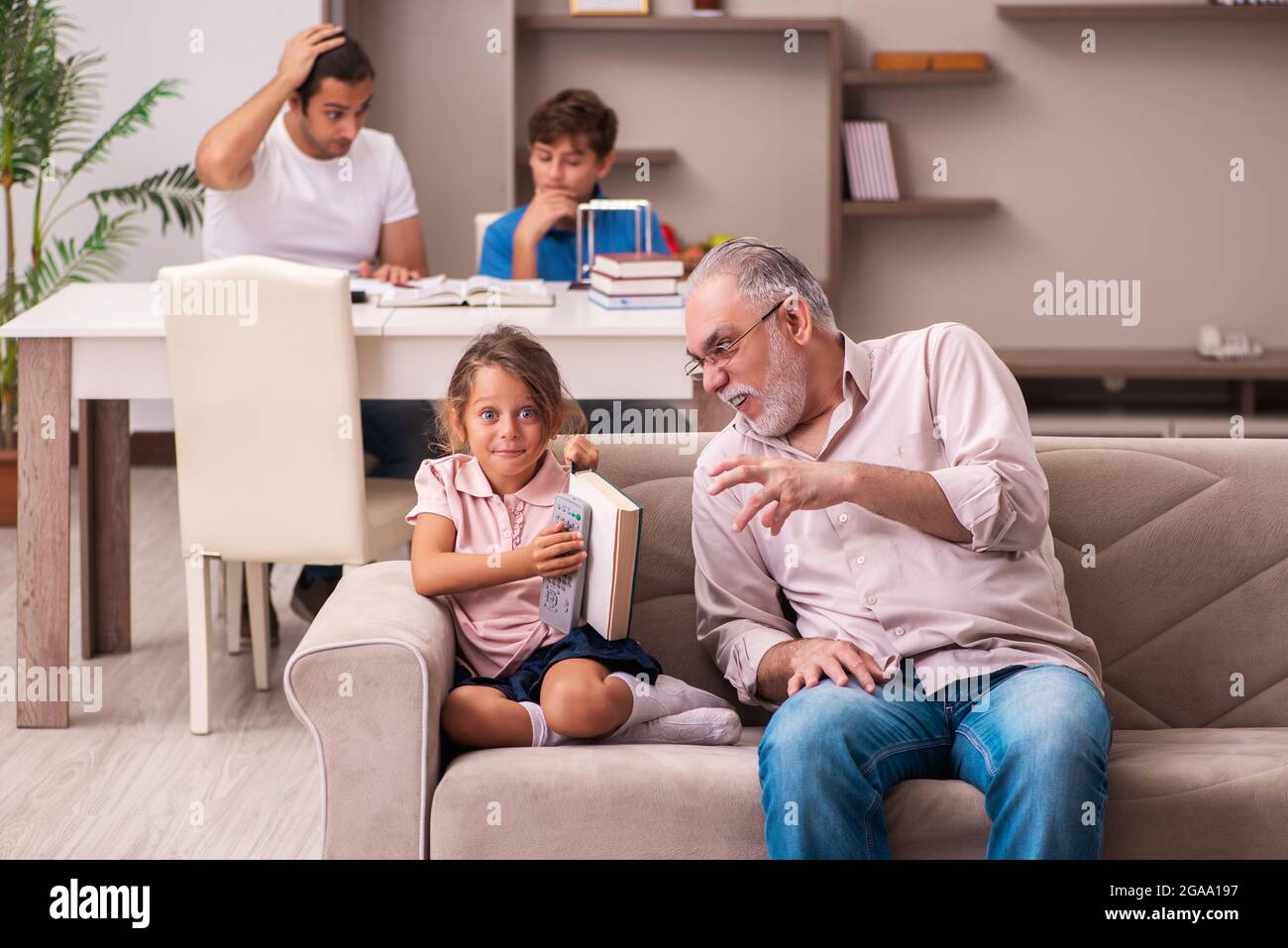 Three generations at home in early development concept Stock Photo - Alamy