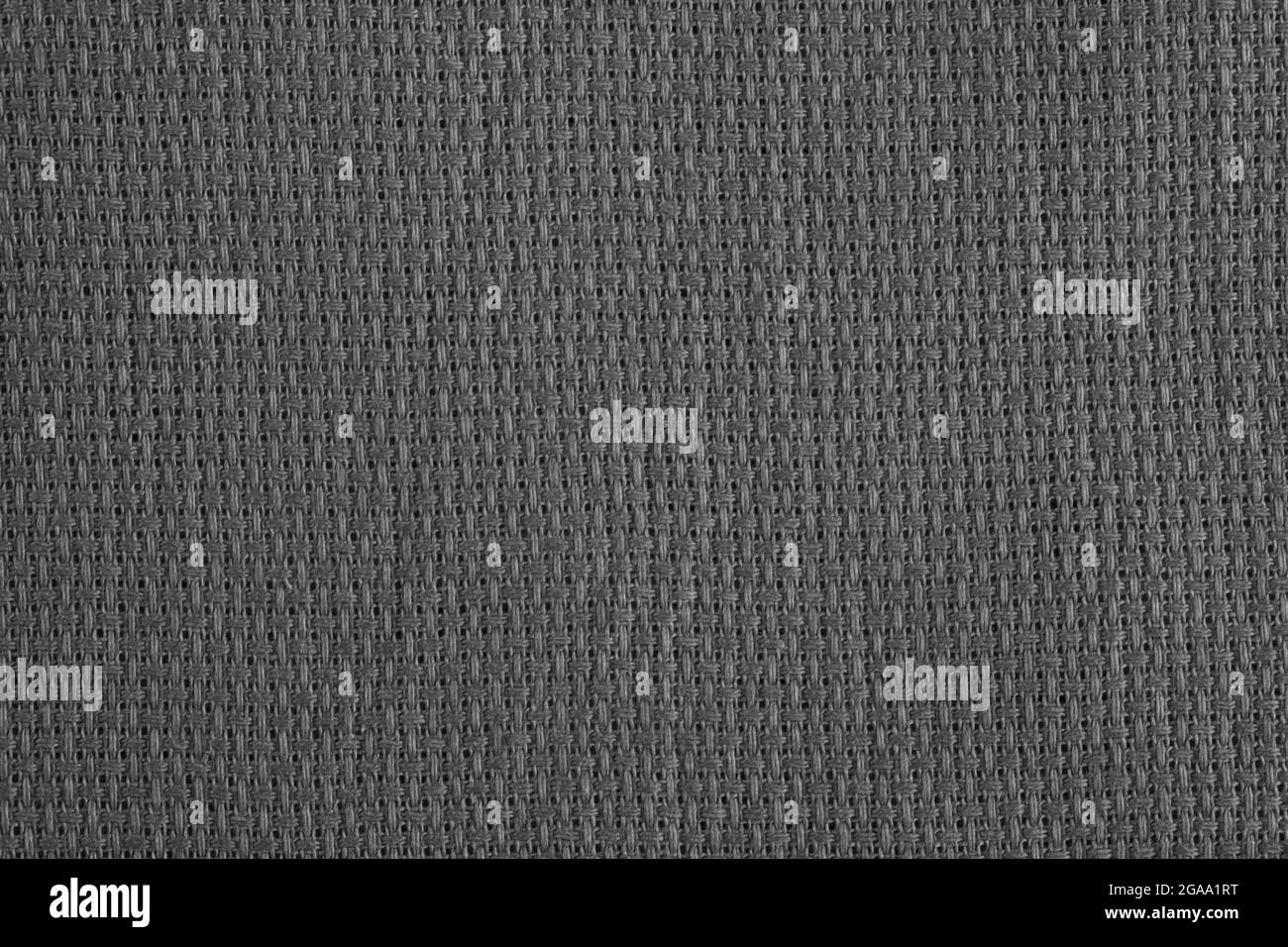 Gray fabric close-up. Weaving of individual threads. Knitted polyester ...