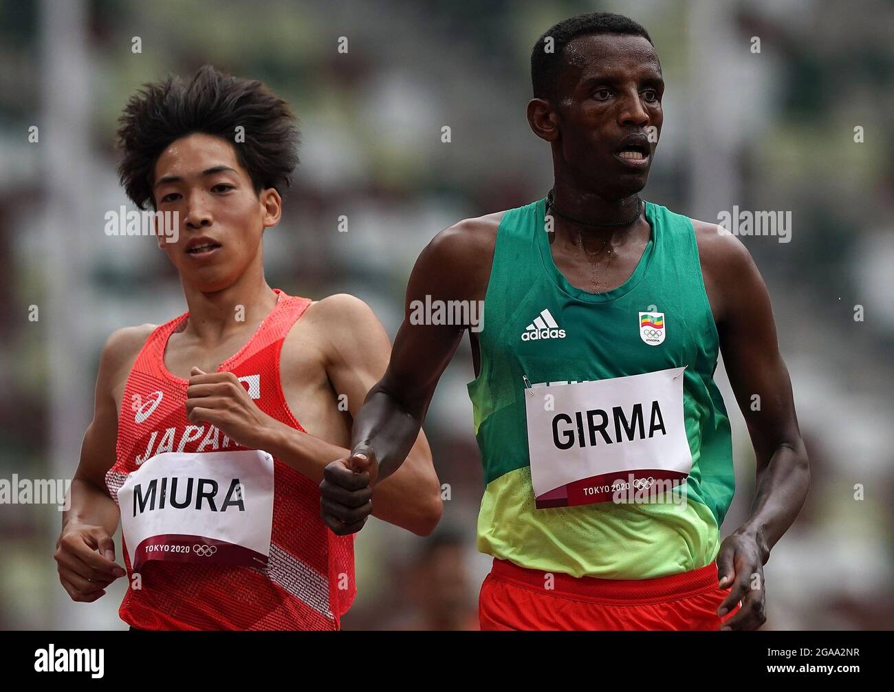 Tokyo, Japan. 30th July, 2021. Lamecha Girma of Ethiopia (L) and Miura ...