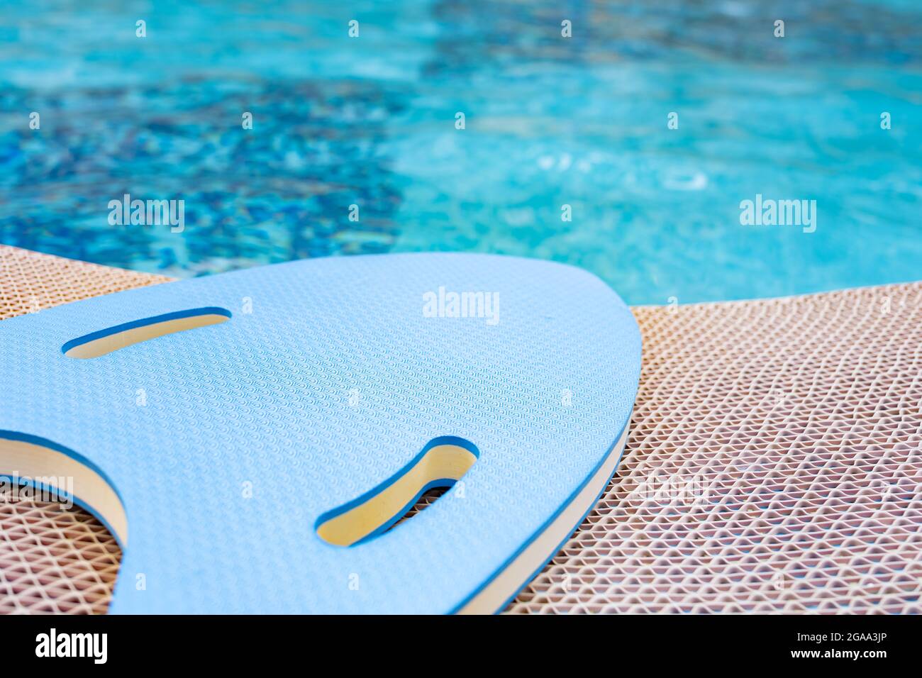 blue floating pad near a swimming pool Stock Photo - Alamy