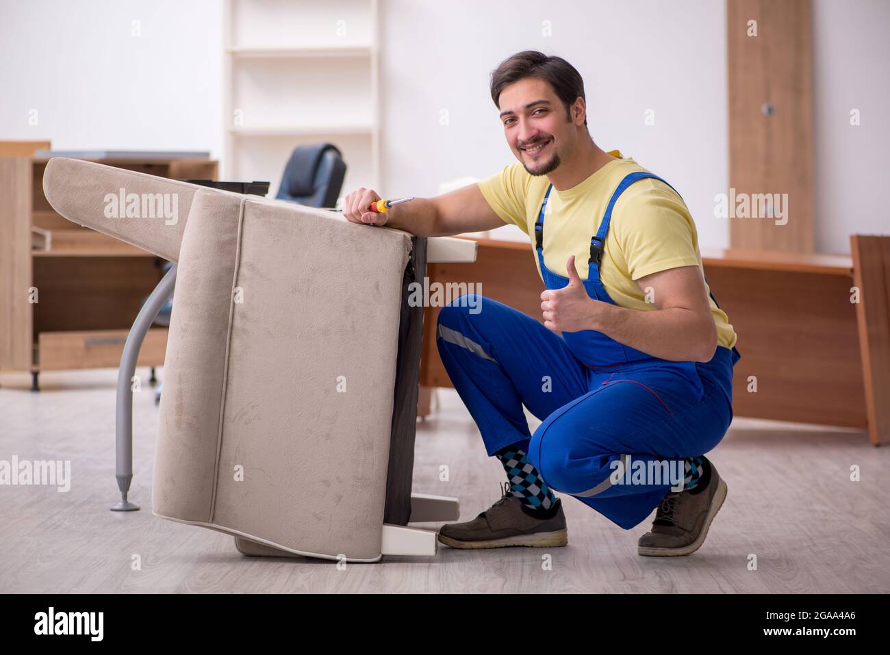 Workman assembling office chair hi-res stock photography and images - Alamy