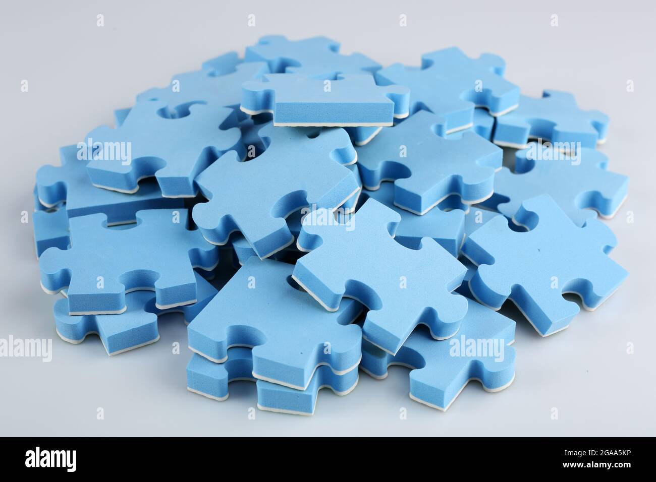 Pile of blue puzzle pieces, closeup Stock Photo - Alamy