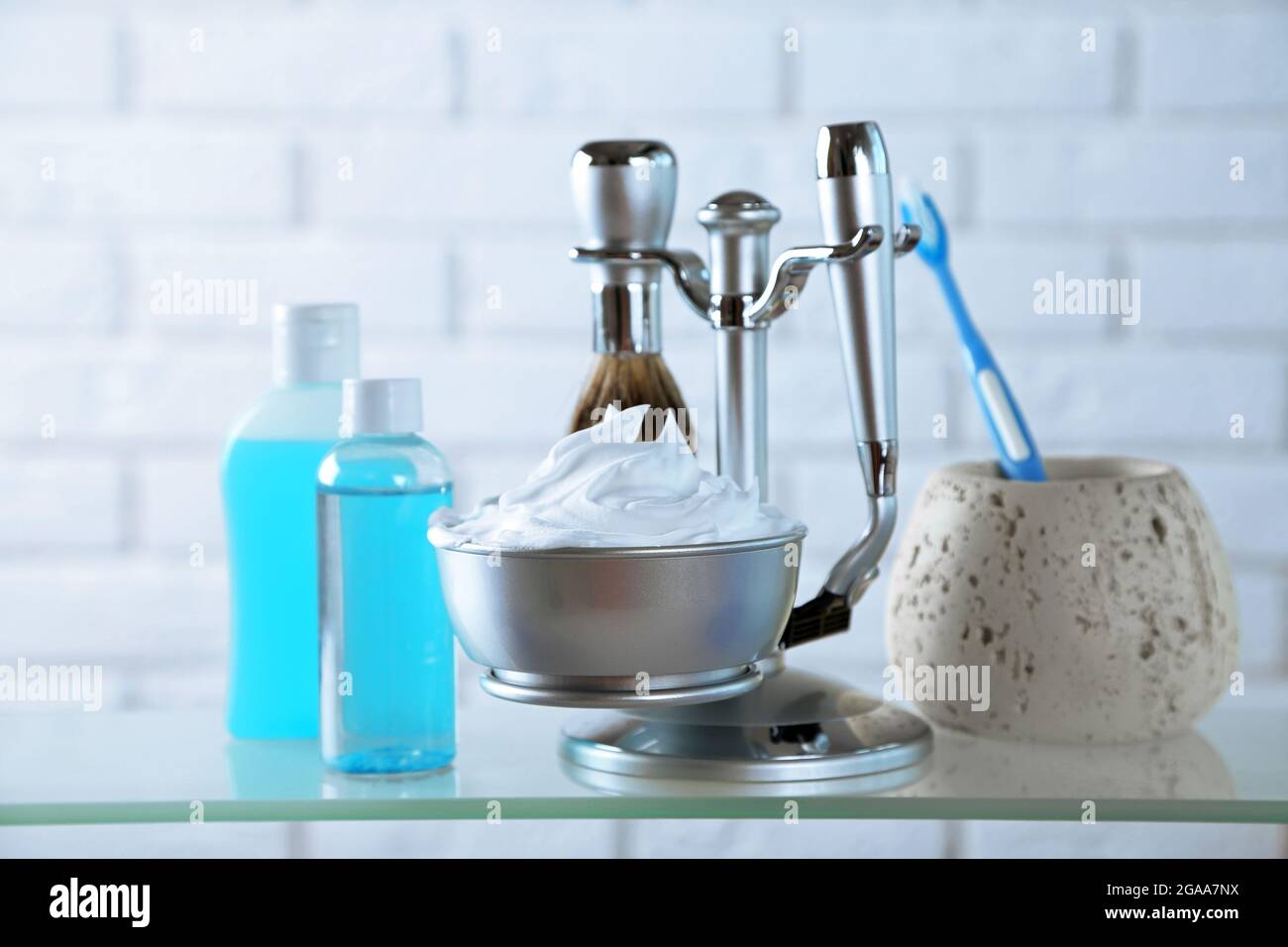 Male luxury shaving kit on shelf, on bricks wall background Stock Photo ...