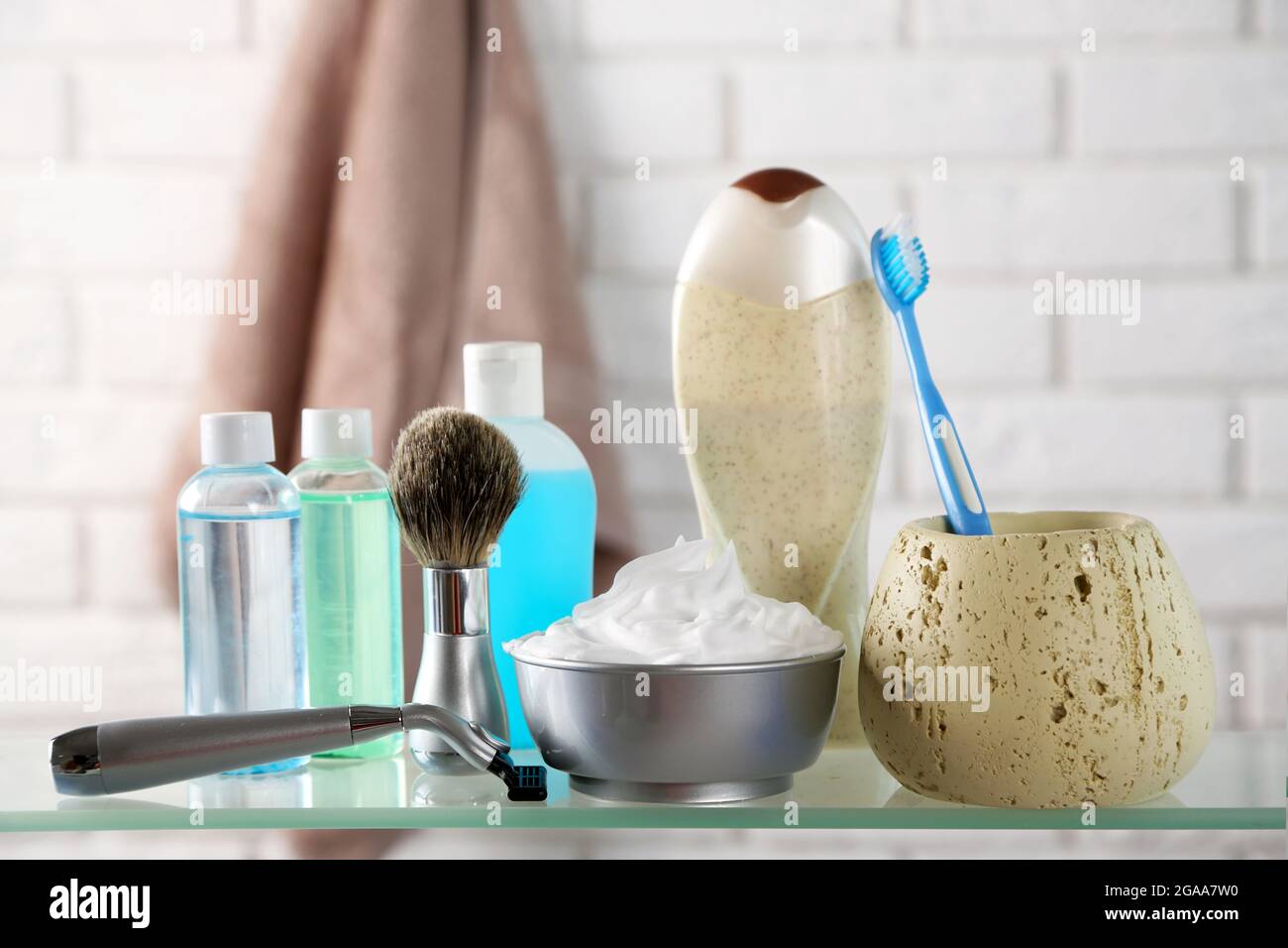 Male luxury shaving kit on shelf, on bricks wall background Stock Photo ...