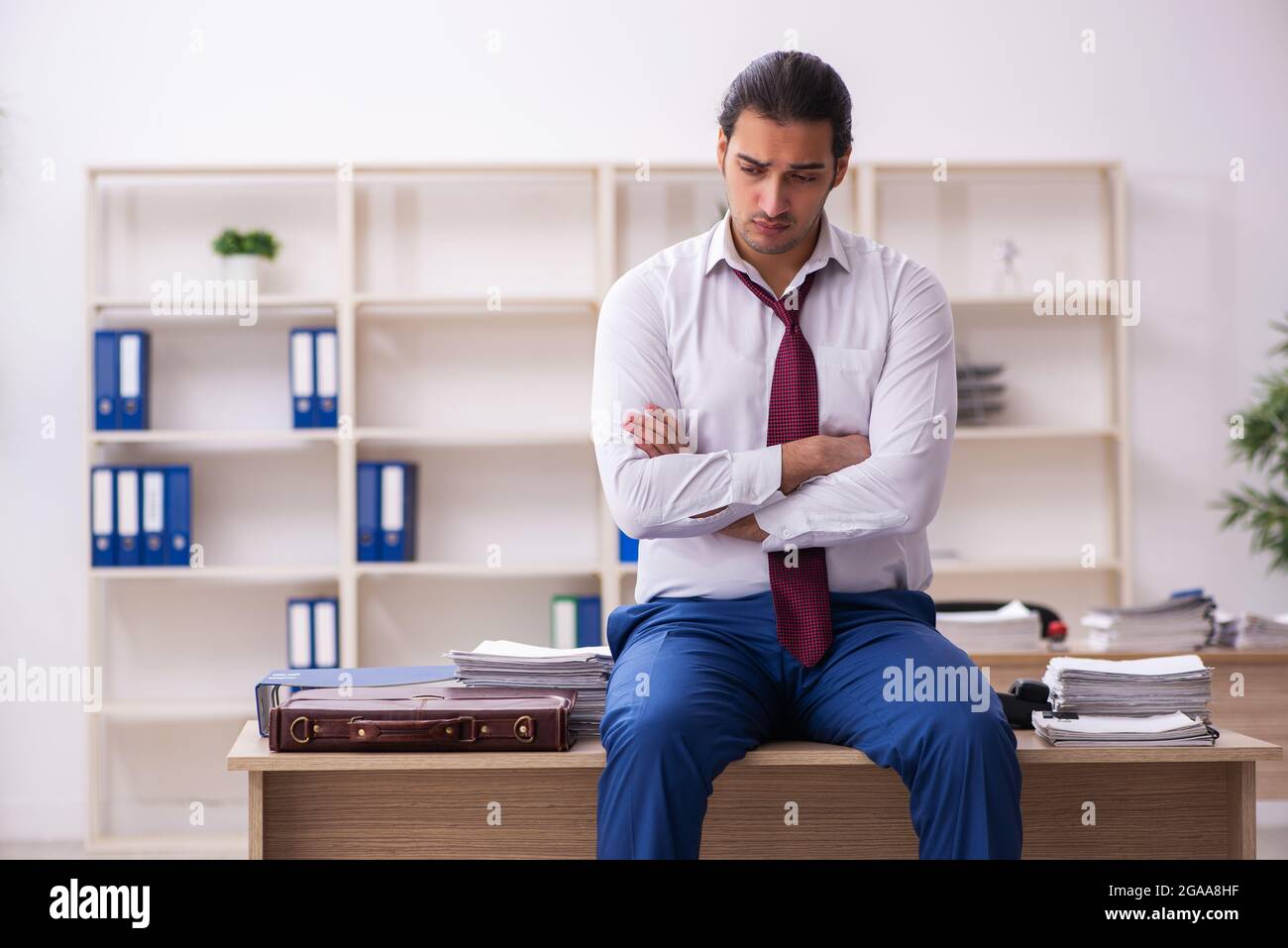 Extremely tired businessman male employee in the office Stock Photo - Alamy