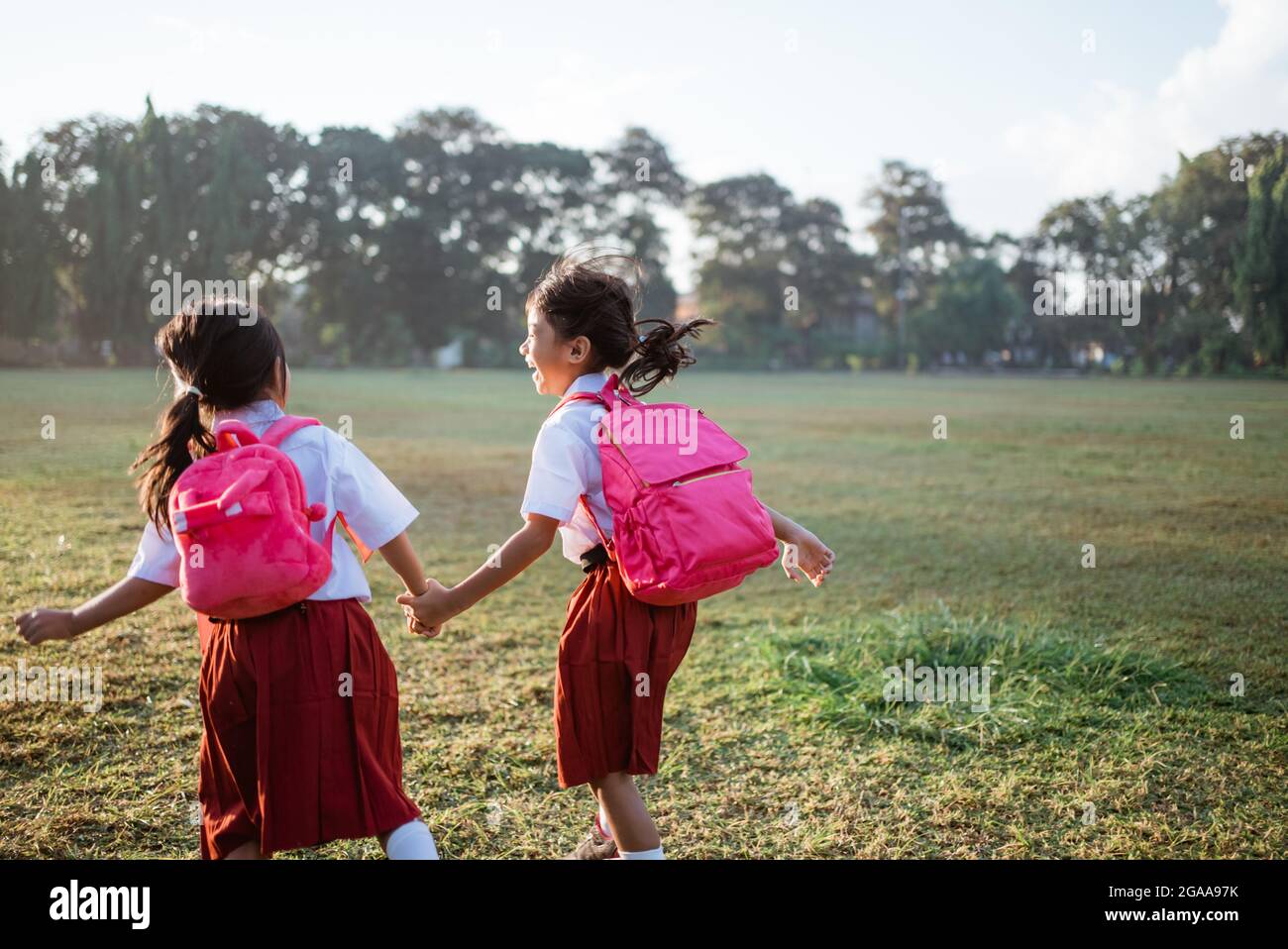 Student uniform walking behind hi-res stock photography and images - Alamy