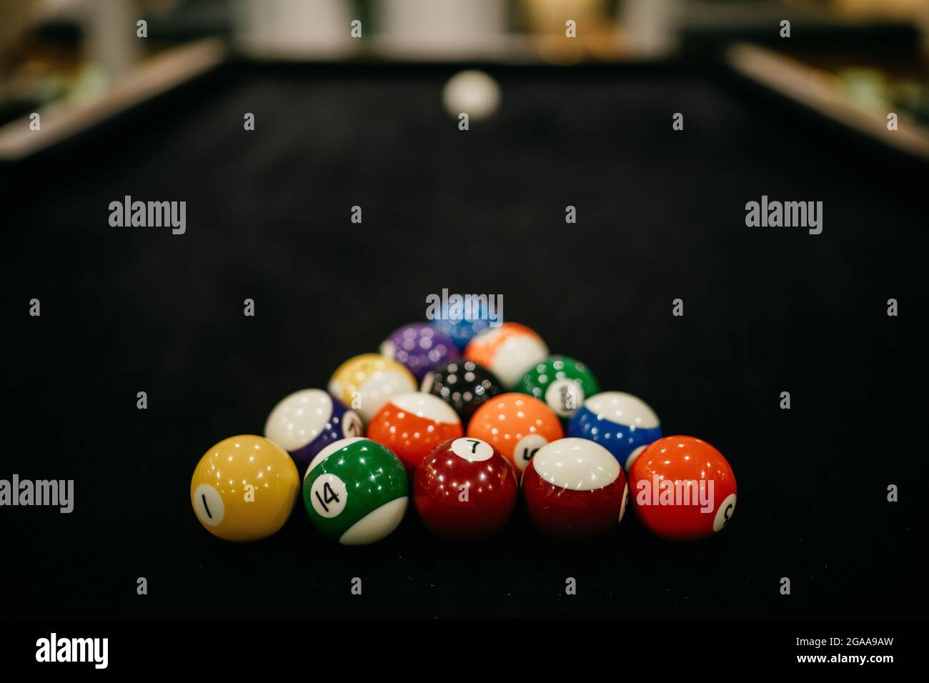 Billards pool game. Colored balls in a triangle aimed at a white sphere ...